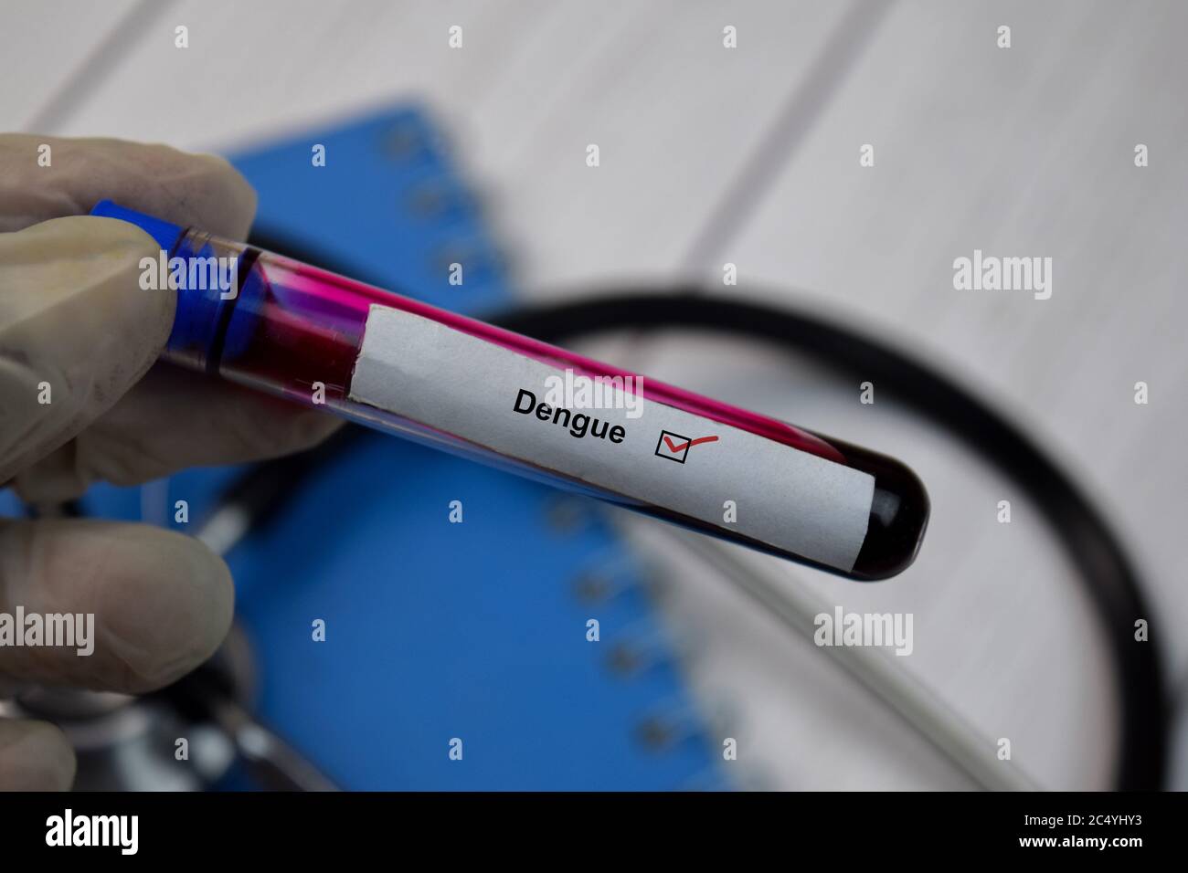 Dengue text with blood sample. Top view isolated on black background ...