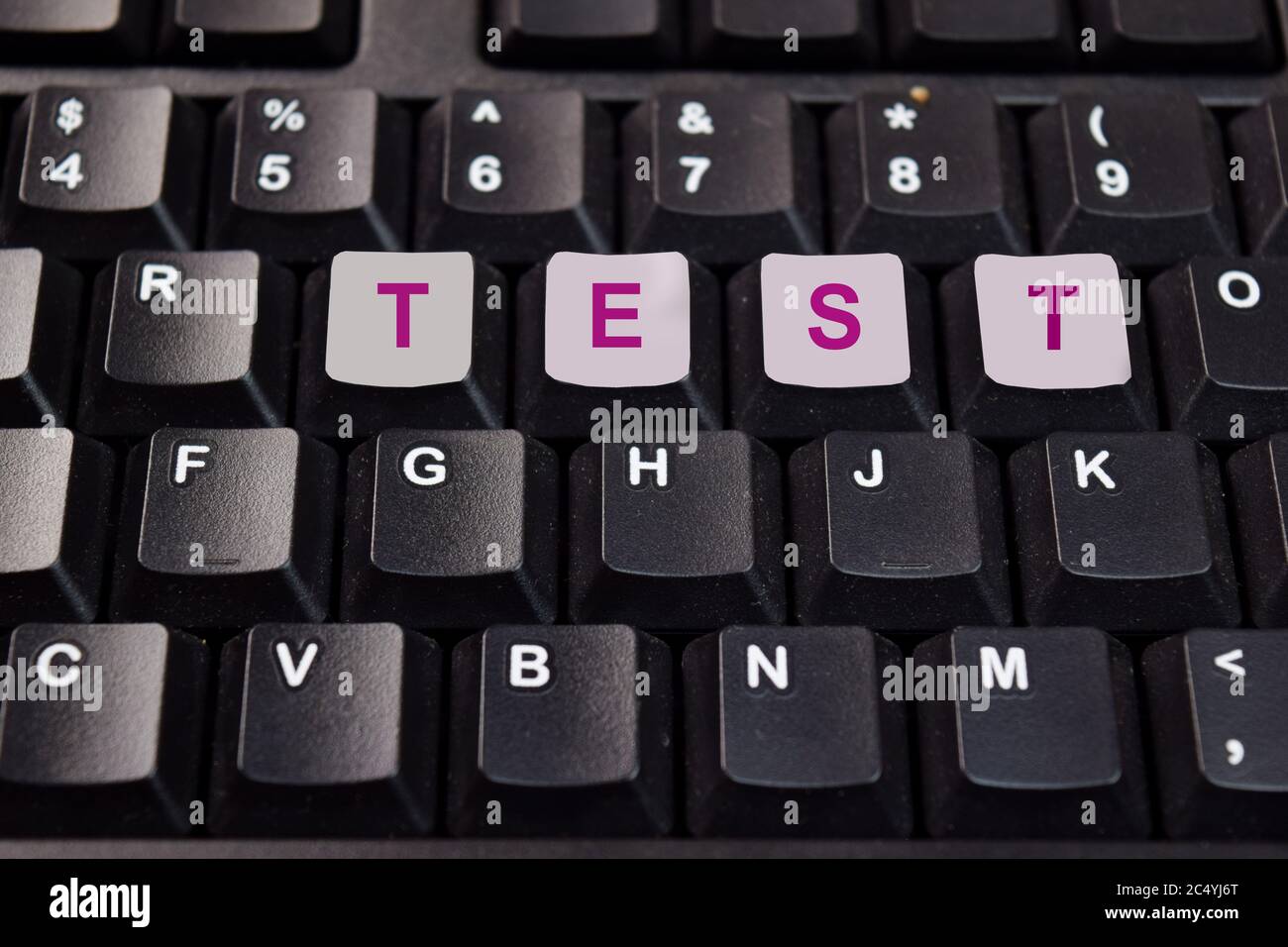 Test write on keyboard isolated on laptop background Stock Photo - Alamy