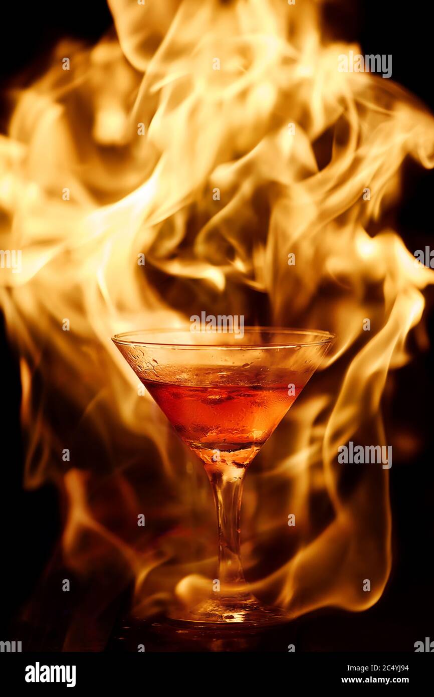 cocktail on fire. fiery cocktail. fire on the bar Stock Photo - Alamy
