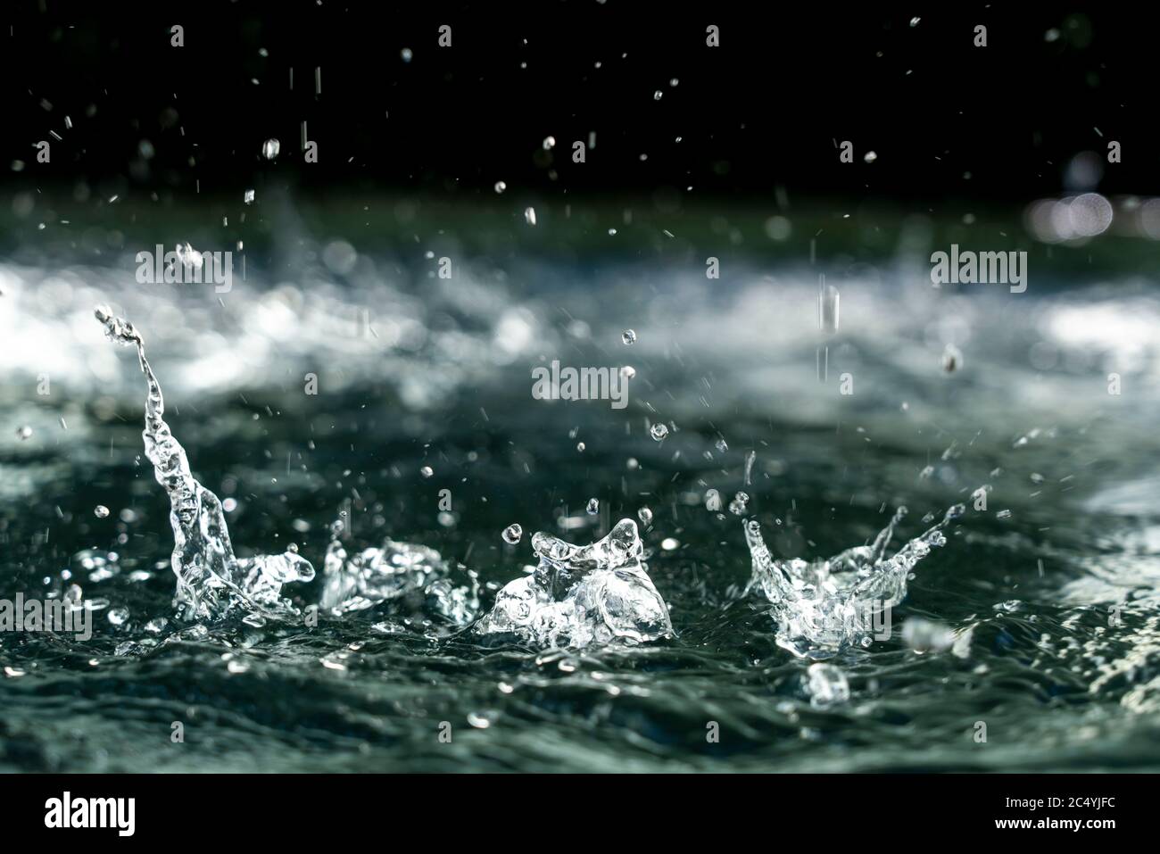 Water drops hitting wet surface hi-res stock photography and images - Alamy