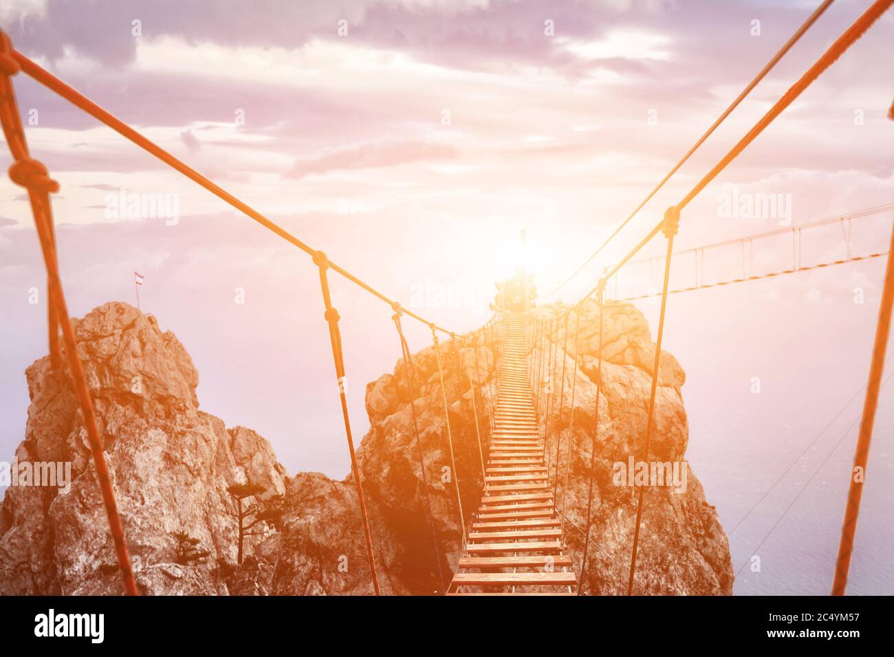 Suspension bridge on the Mount. path to the light Stock Photo - Alamy