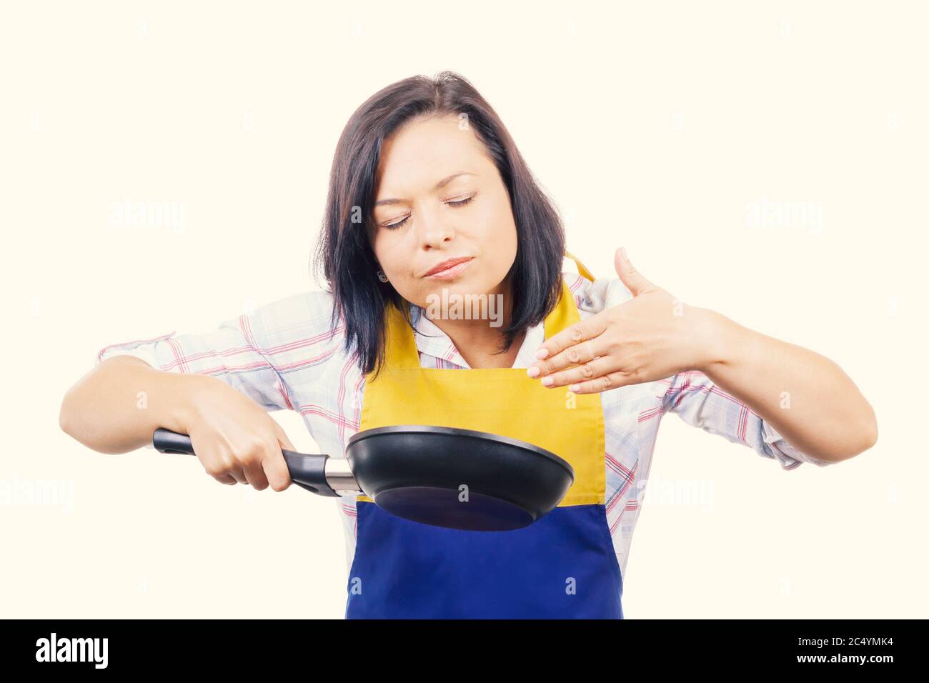 Beautiful Young Woman with Frying Pan on a white background Stock Photo ...