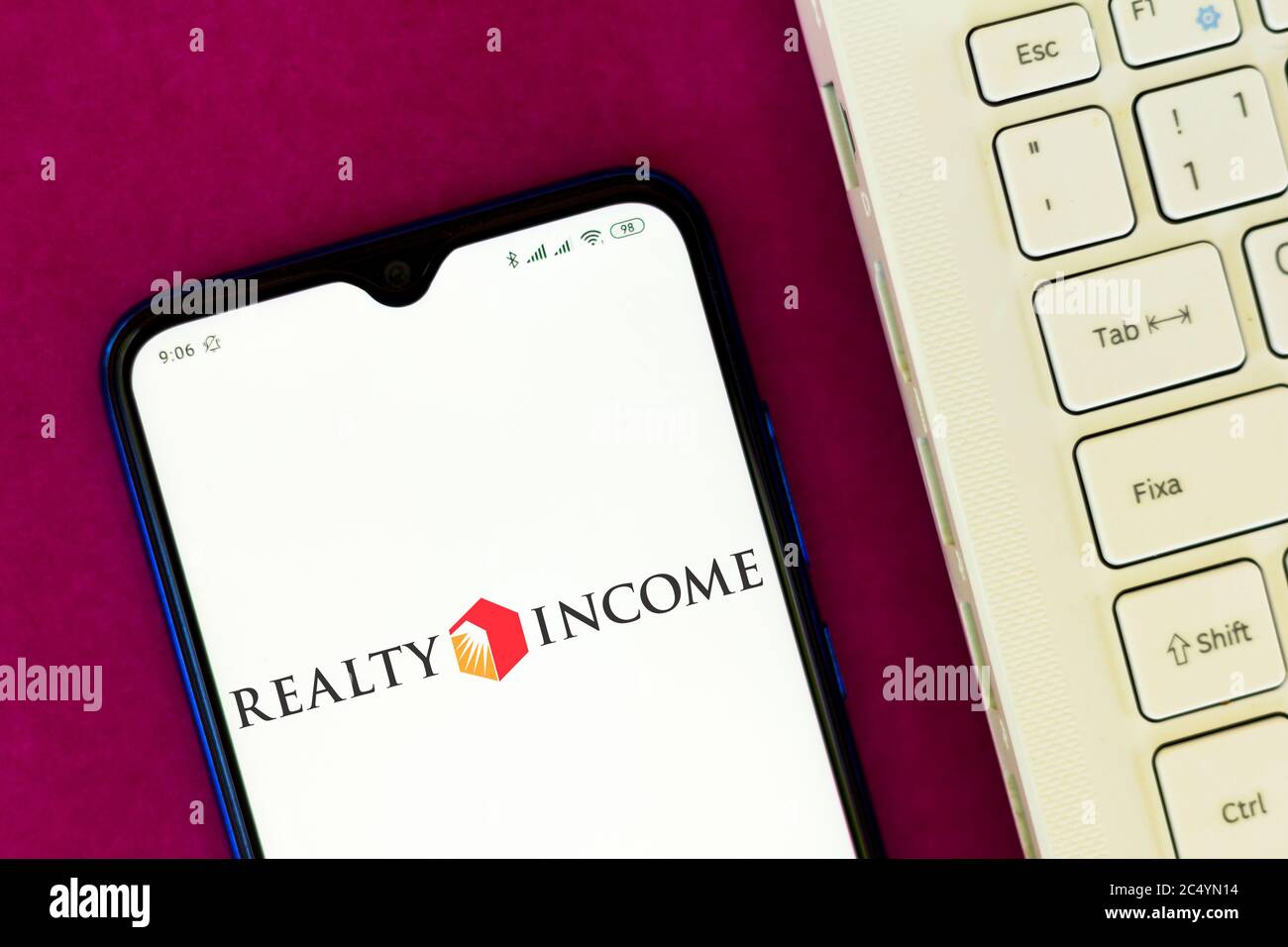 In this photo illustration the Realty Income Corporation logo seen ...