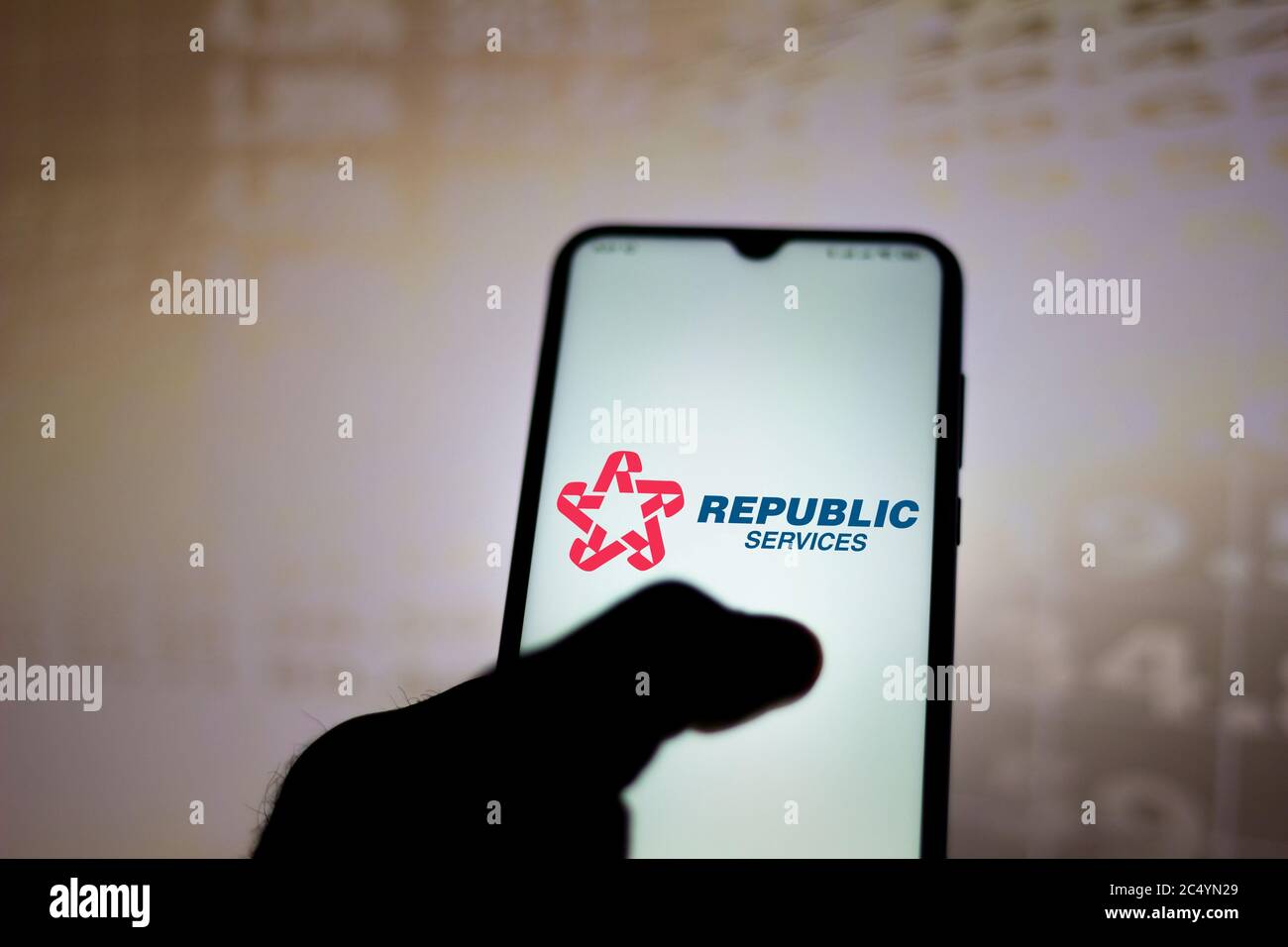In this photo illustration the Republic Services logo seen displayed on ...