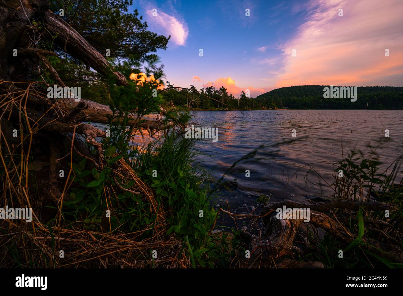 Summer Solstice Sunset on a lake in Catskills Mountains, NY, USA Stock ...