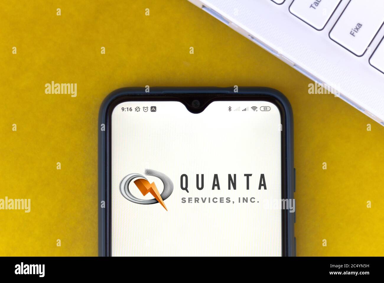 In this photo illustration the Quanta Services logo seen displayed on a ...