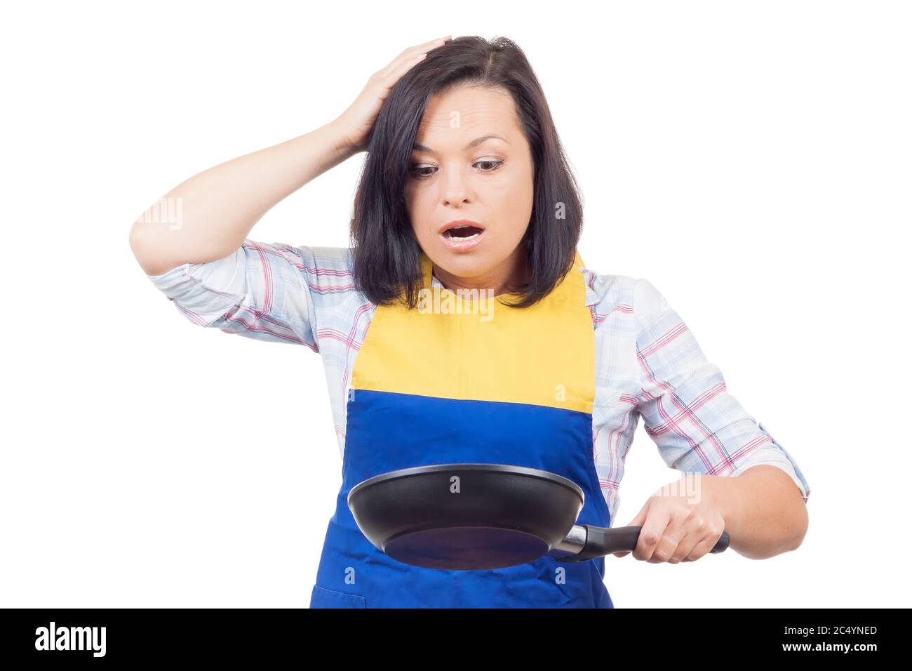 Shocked Young Woman with Frying Pan on a white background Stock Photo ...
