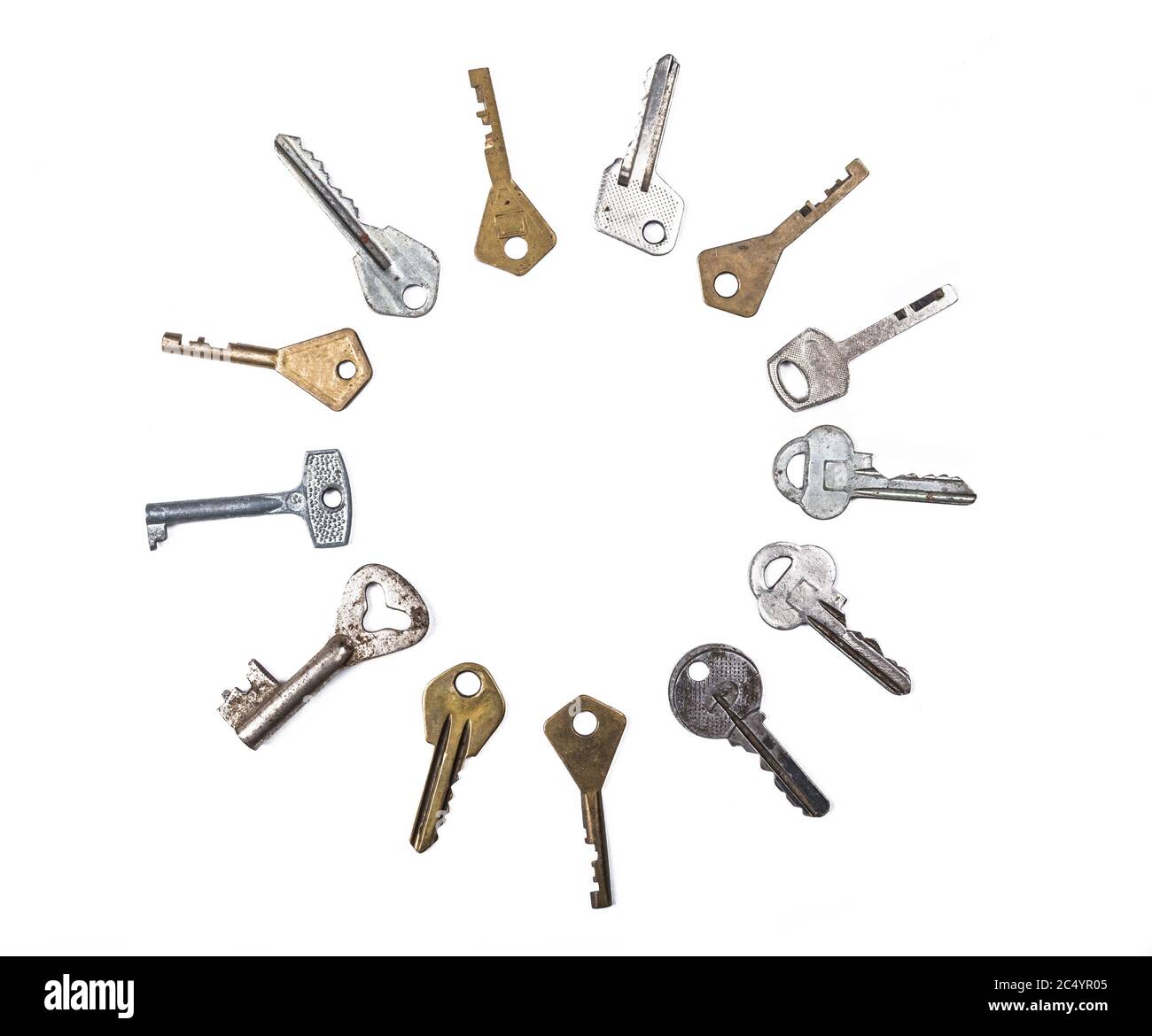 Many assorted old multi-colored metal antique keys of different shapes ...