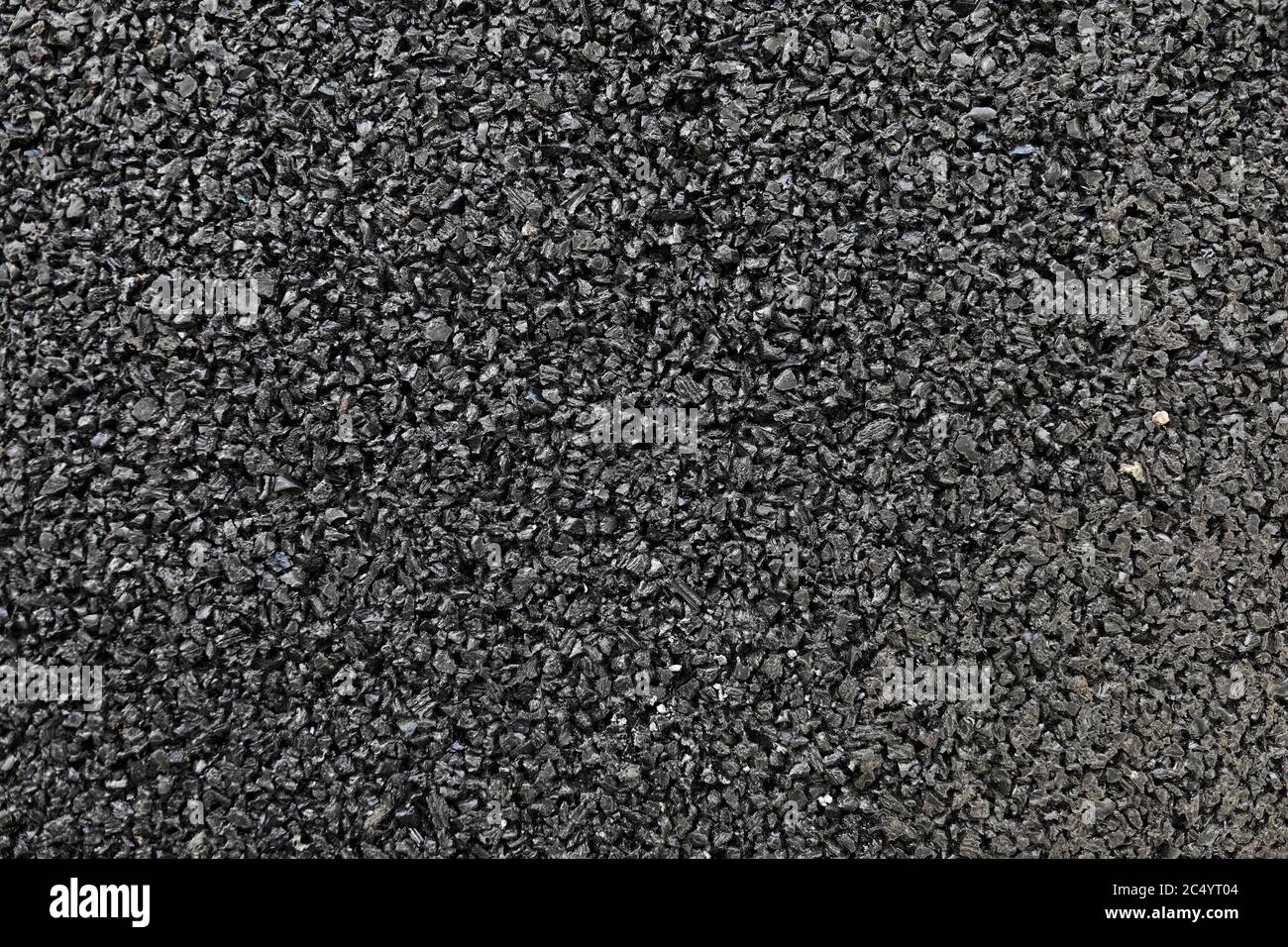 Black colored granulated material texture Stock Photo - Alamy