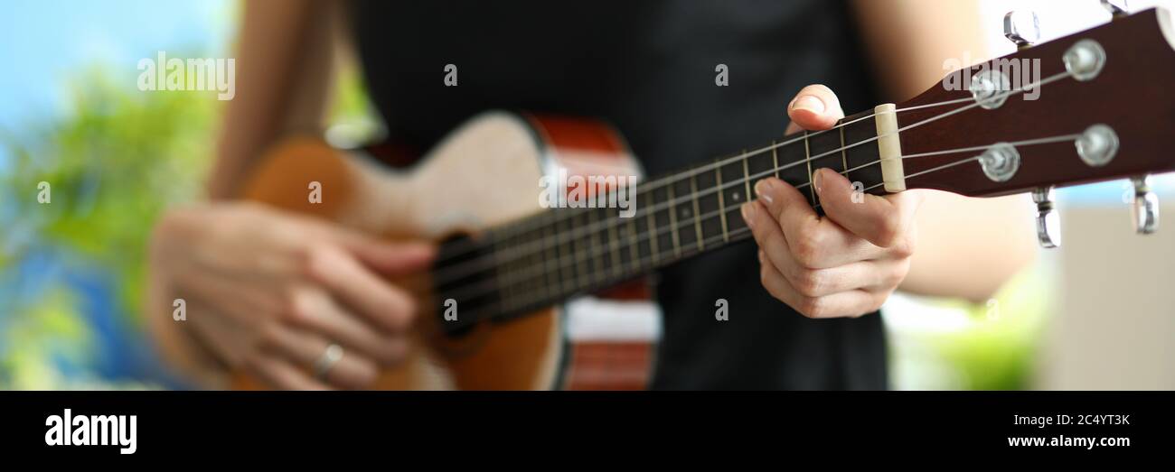 How to play ukulele hi-res stock photography and images - Alamy