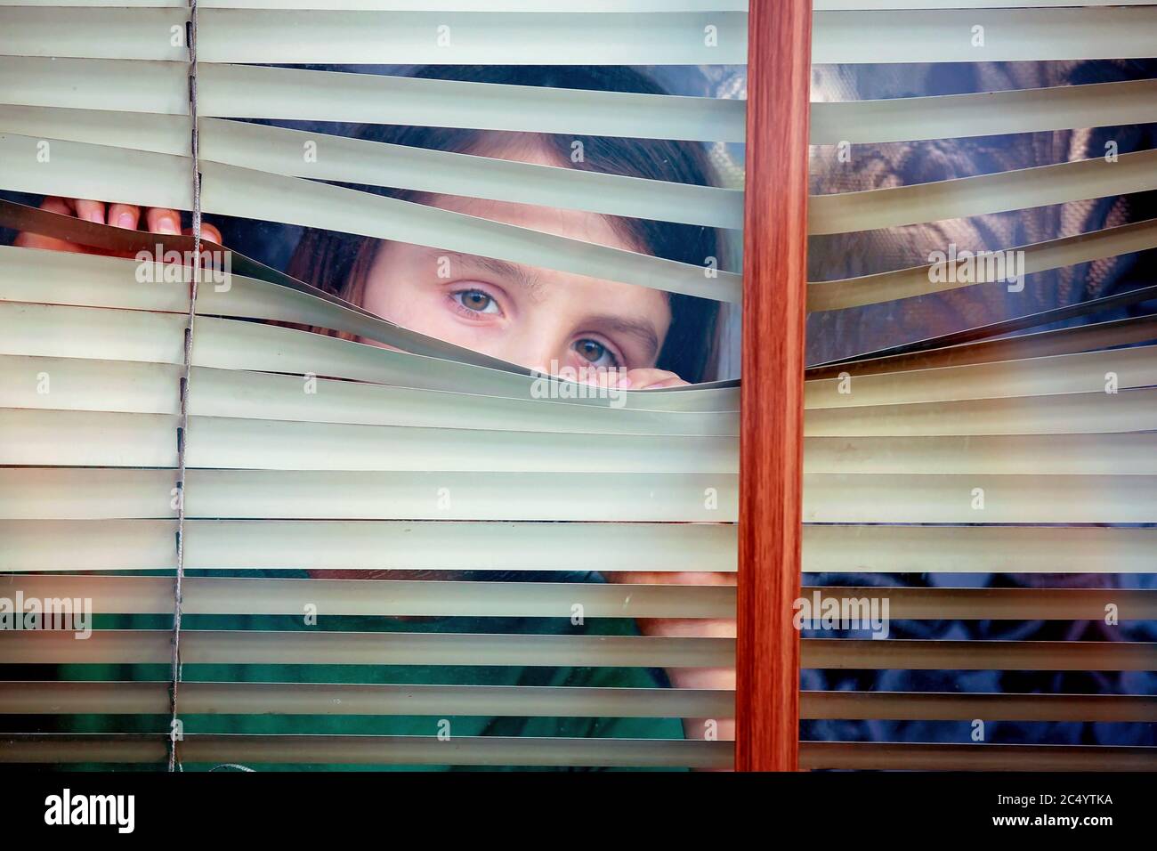 Child, toddler boy, looking through window outside Stock Photo - Alamy