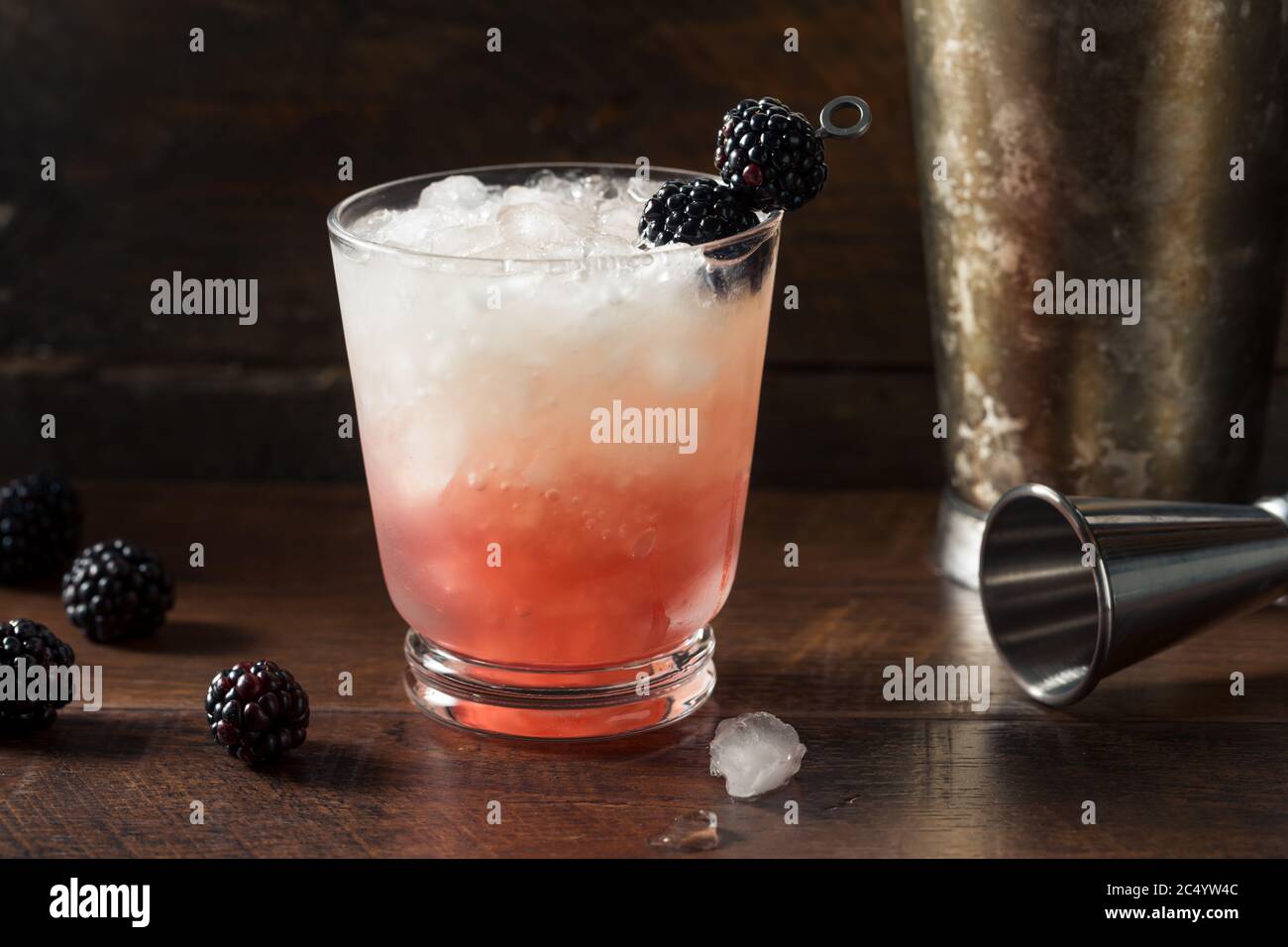 Boozy Blackberry Bramble Gin Cocktail with Lemon Stock Photo - Alamy