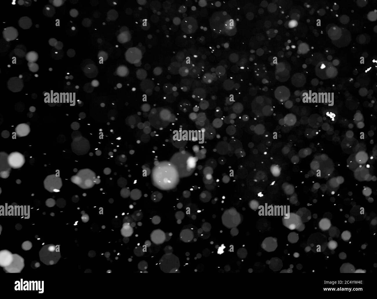 Snowfall on black background Stock Photo - Alamy