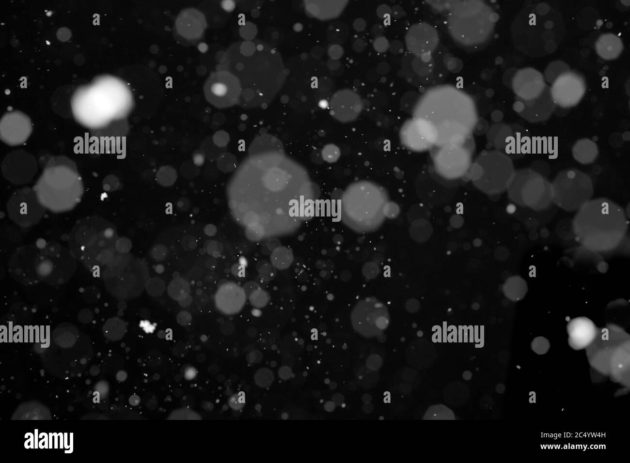 Snowfall on black background Stock Photo - Alamy