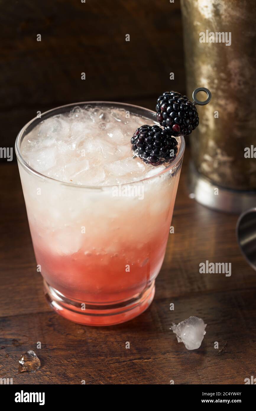 Boozy Blackberry Bramble Gin Cocktail with Lemon Stock Photo - Alamy