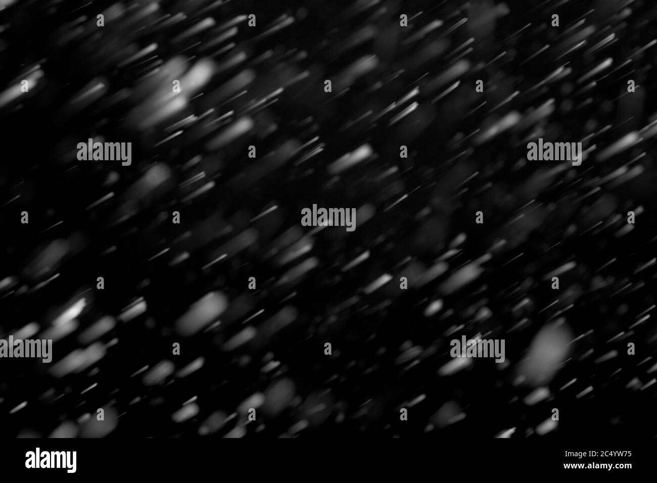 Snowfall on black background - design element Stock Photo - Alamy