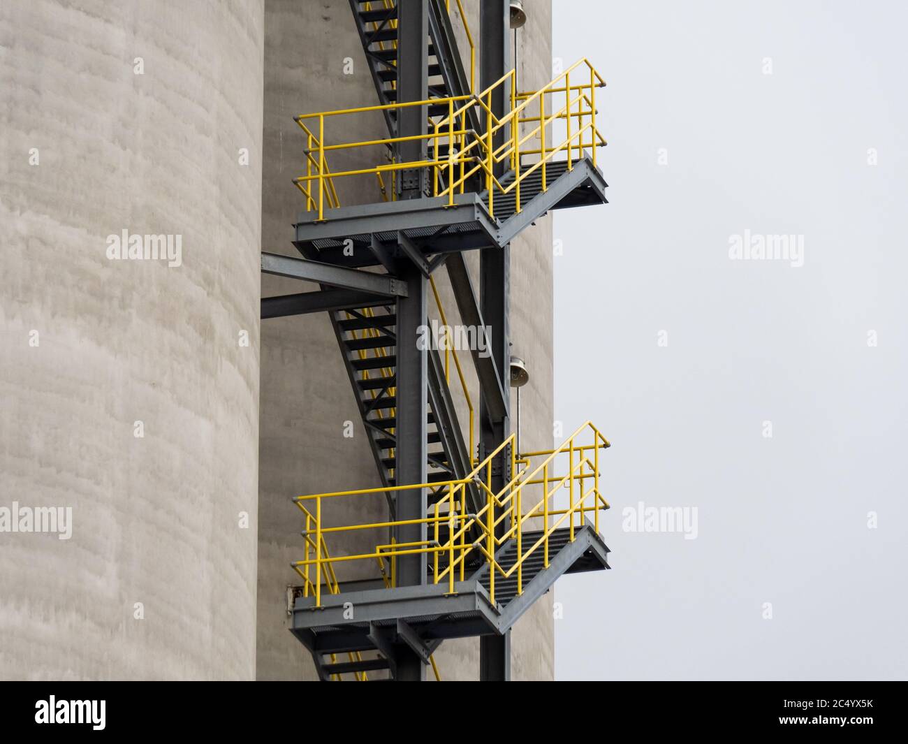 stairs and railing on the outside of an industrial silo Stock Photo - Alamy