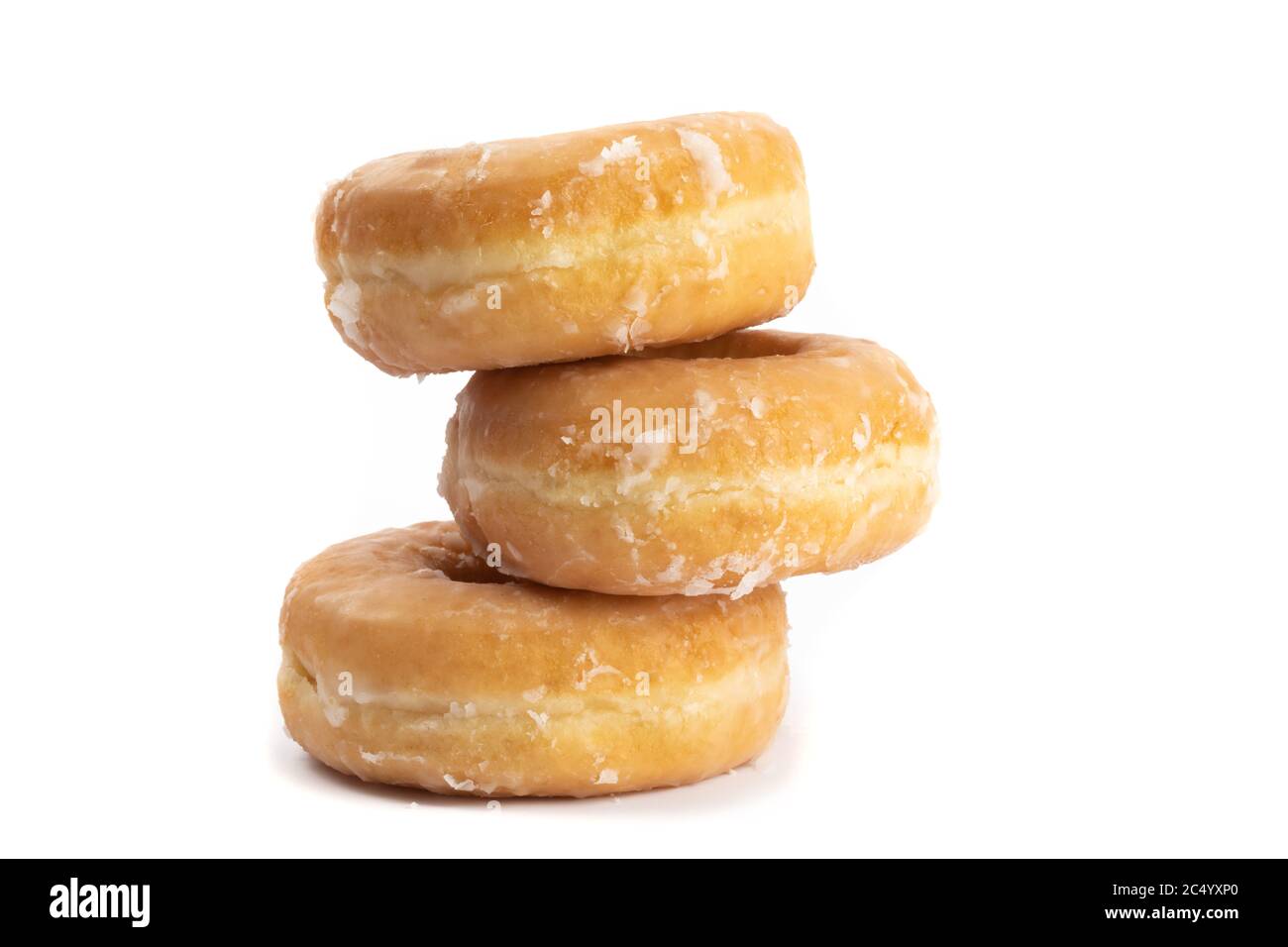 a stack of three sugar dipped doughnuts isolated on white Stock Photo ...