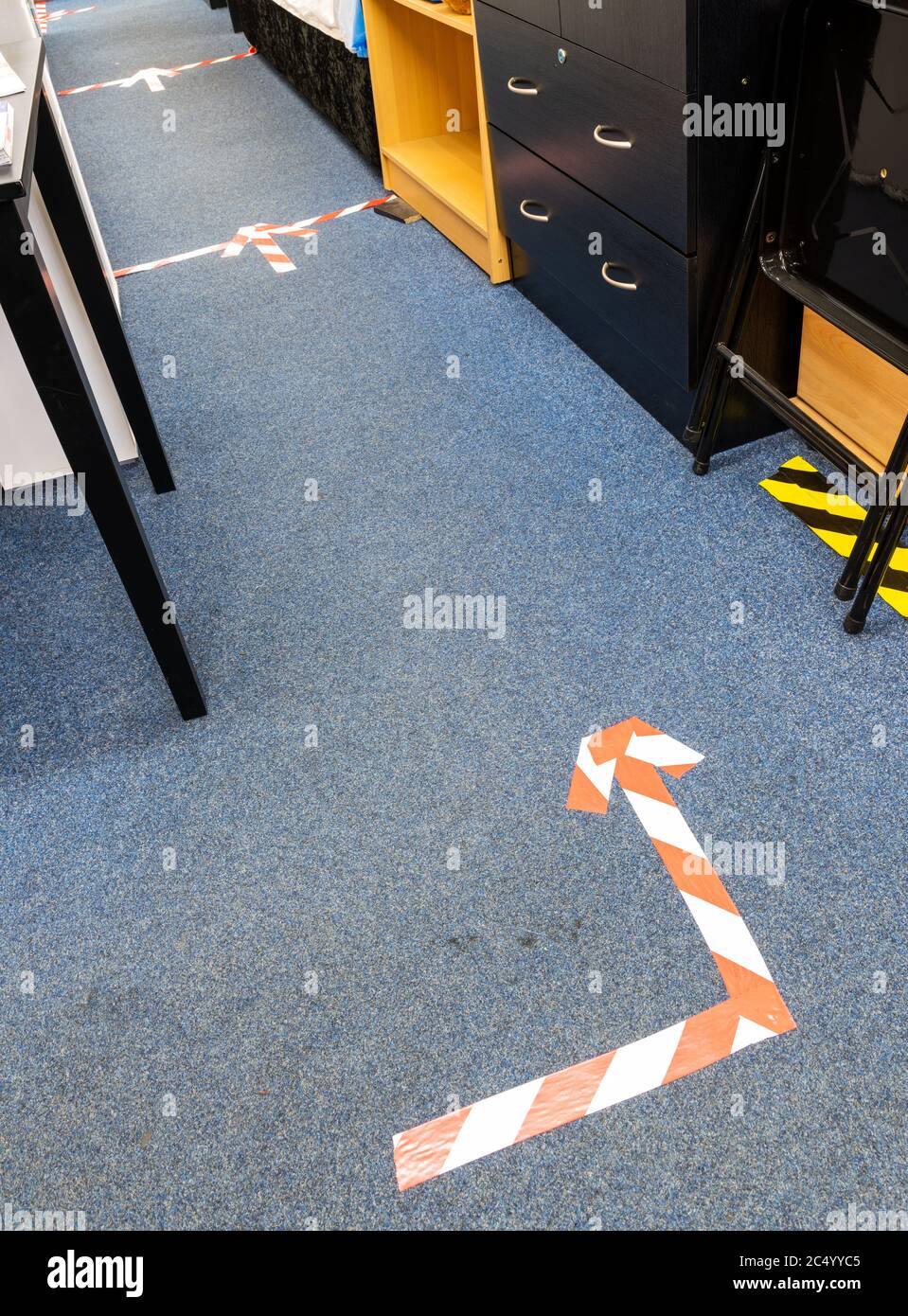 Directional markings on the floor of a furniture shop as required by ...