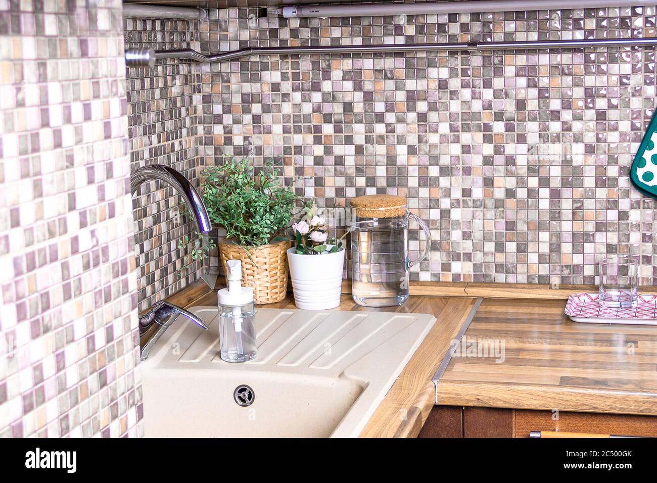 Brown wooden kitchen sink with plants and water Stock Photo - Alamy