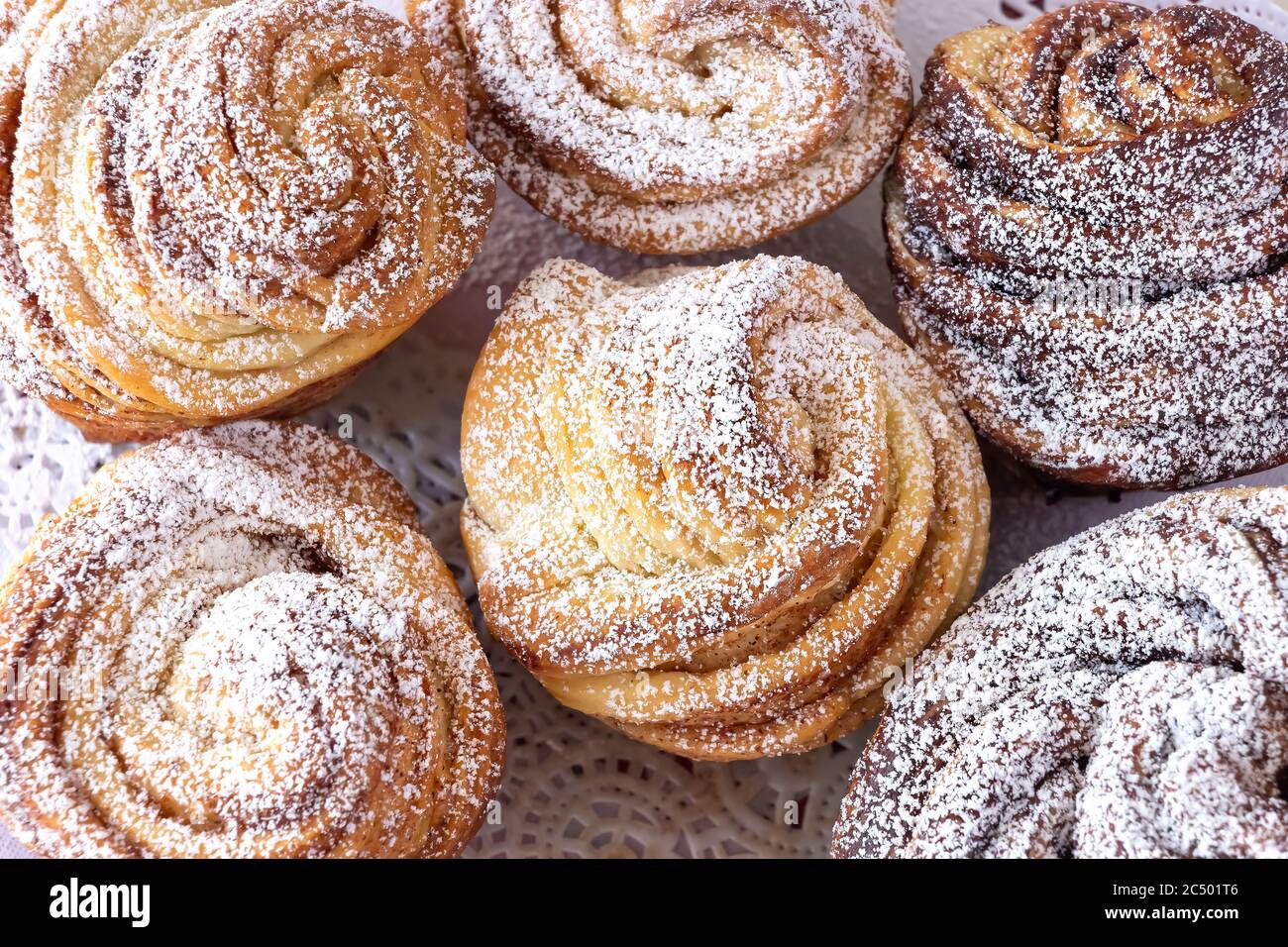 Homemade modern cruffin cake, yeast rolled cinnamon bun sprinkled ...