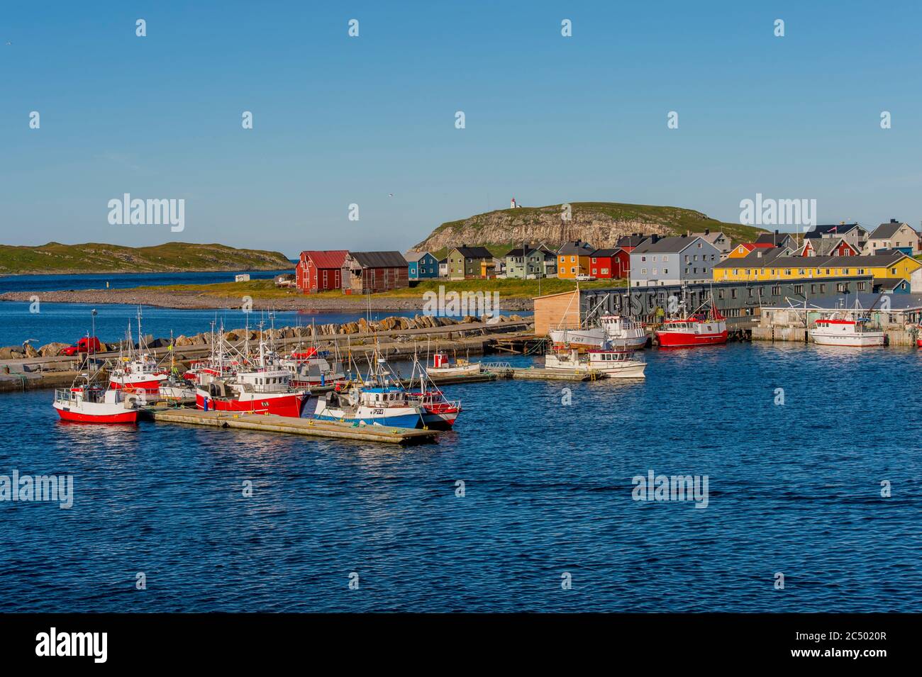 View of fishing boats in the harbor of Vardo, a town on an island in ...