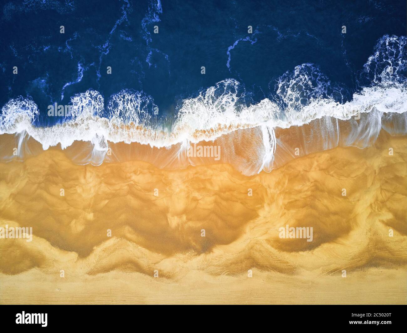 Aerial View looking down on a Beach. Deep Blue waves and beach Stock ...