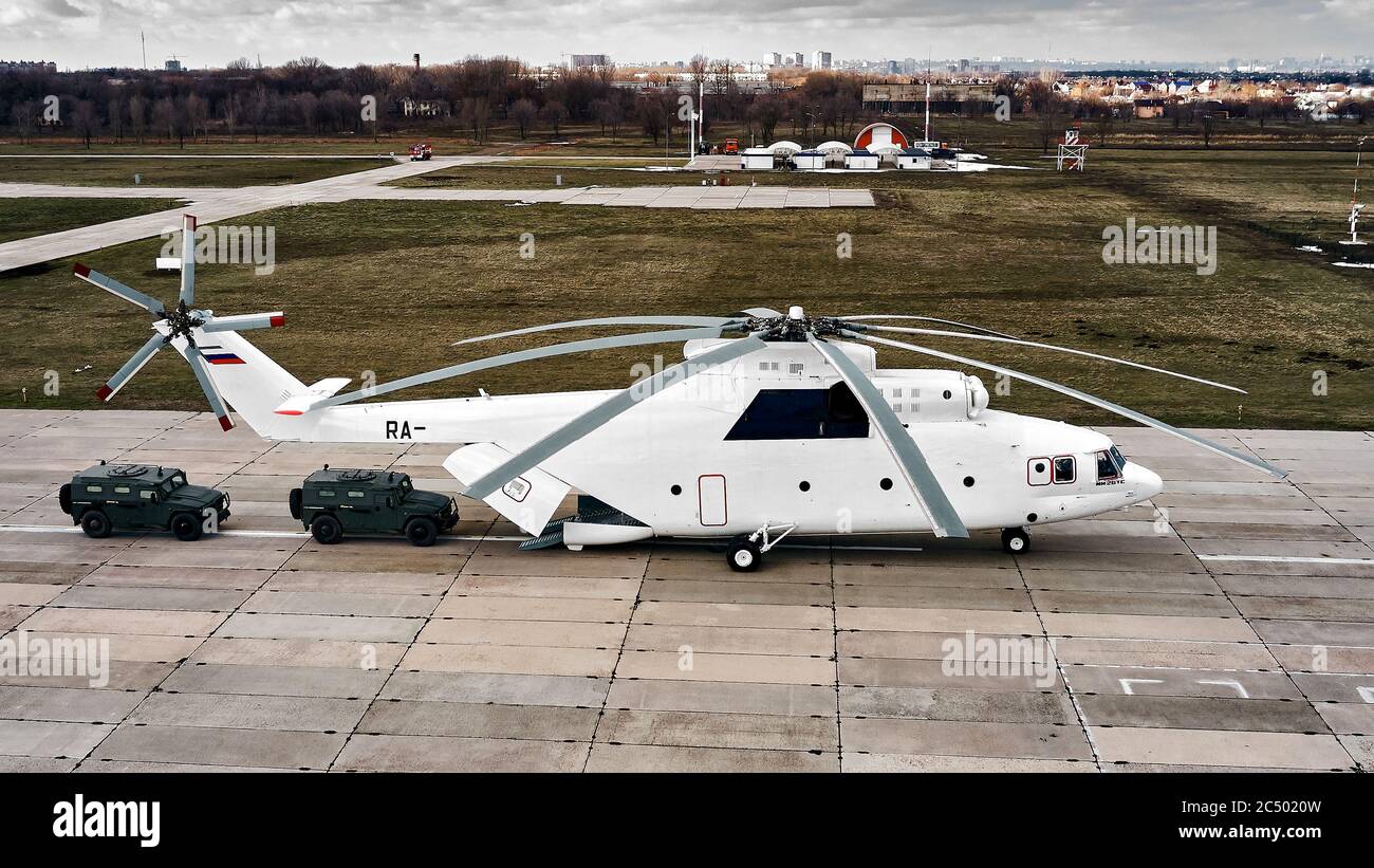 Heavy transport helicopter aerial view. loading equipment on the runway ...