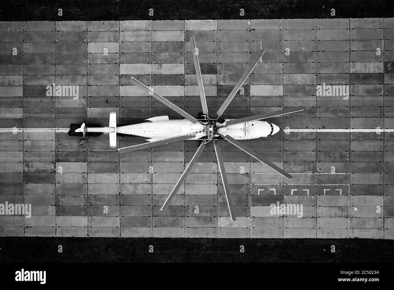 Heavy transport helicopter aerial view. loading equipment on the runway ...