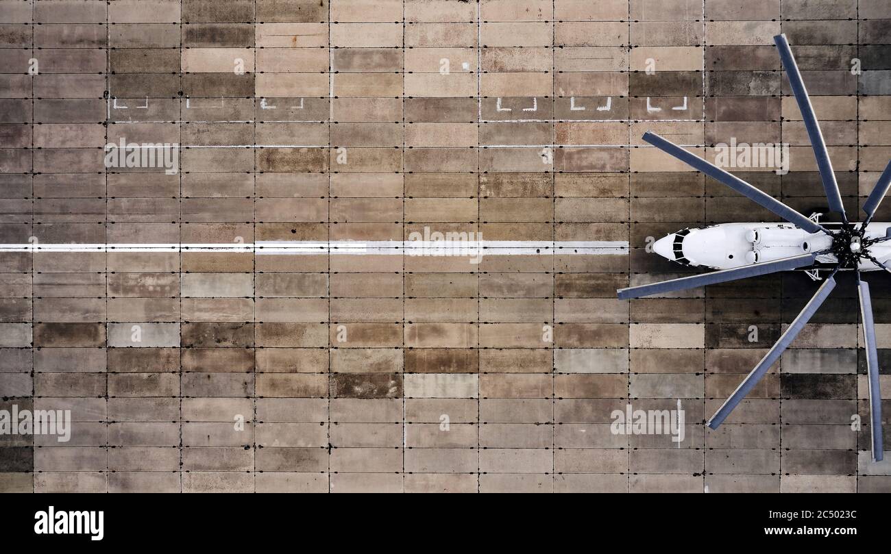 Heavy transport helicopter aerial view. loading equipment on the runway ...