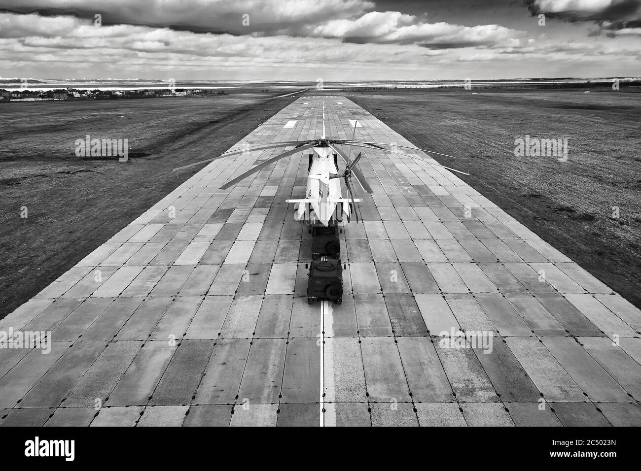 Heavy transport helicopter aerial view. loading equipment on the runway ...