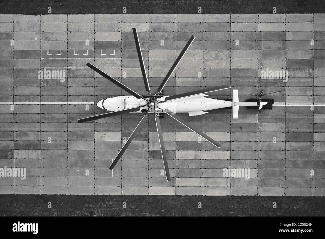 Heavy transport helicopter aerial view. loading equipment on the runway ...