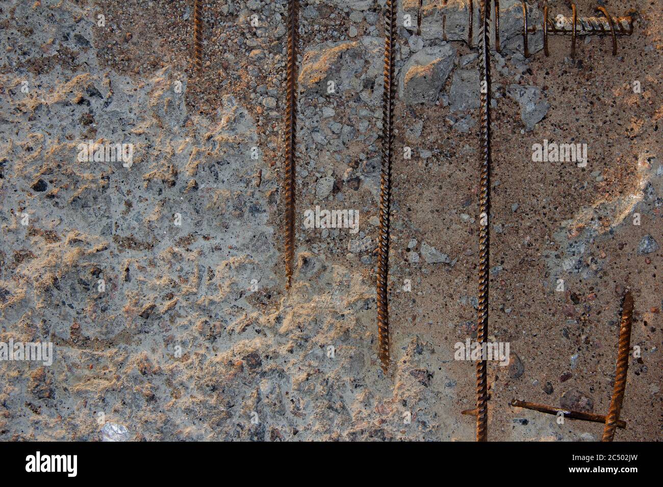 Old surface of grey cracked textured concrete slab with armature rusted ...