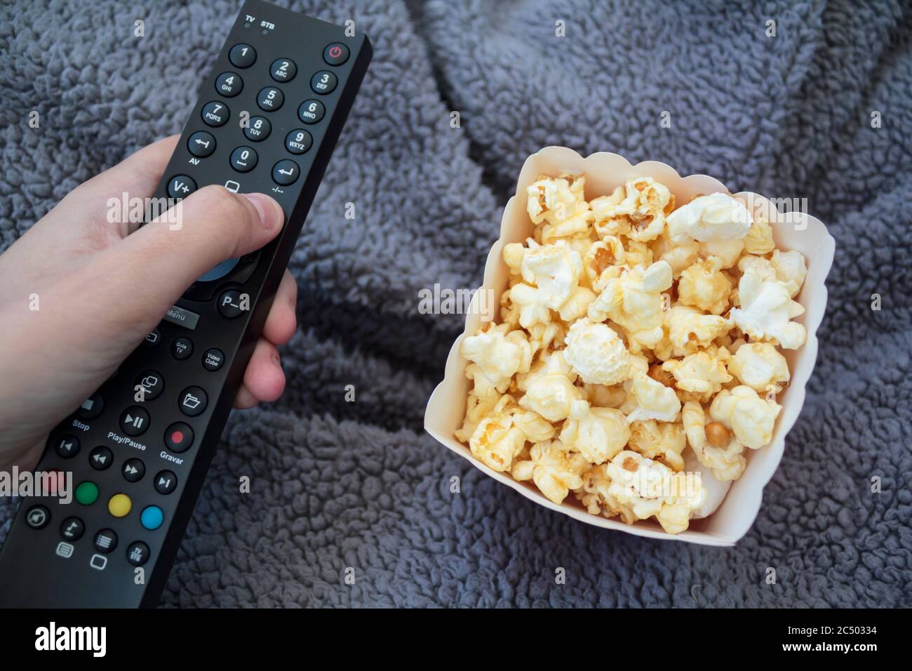 Woman hand holding remote hi-res stock photography and images - Alamy