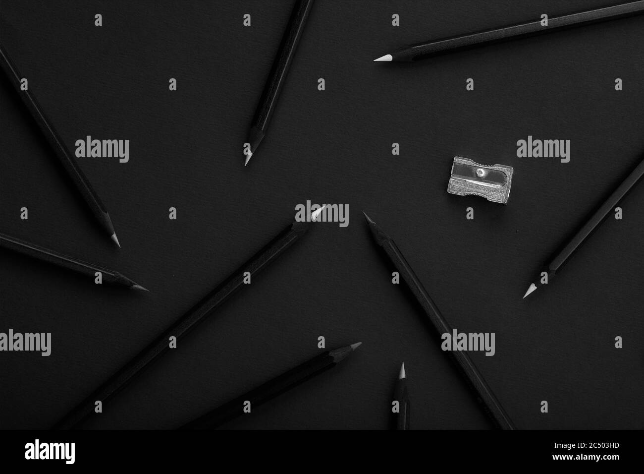 Black colored pencils on black background Stock Photo - Alamy