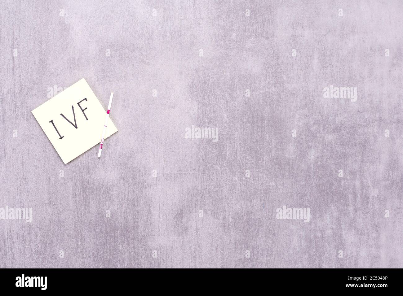 IVF concept. One-strip pregnancy test and sticker with the words ECO ...