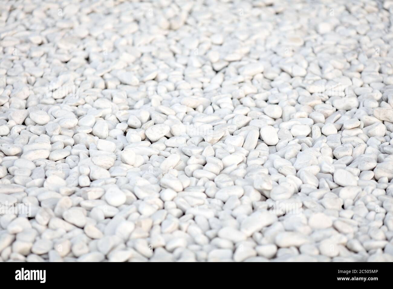 Naturally polished white rock pebbles background. white stones in ...