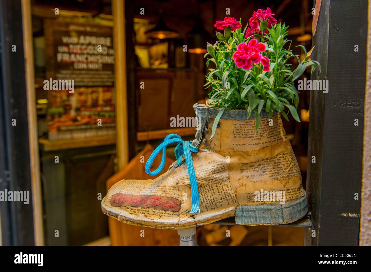 A store is selling old sneakers turned into flower pots in the medieval ...