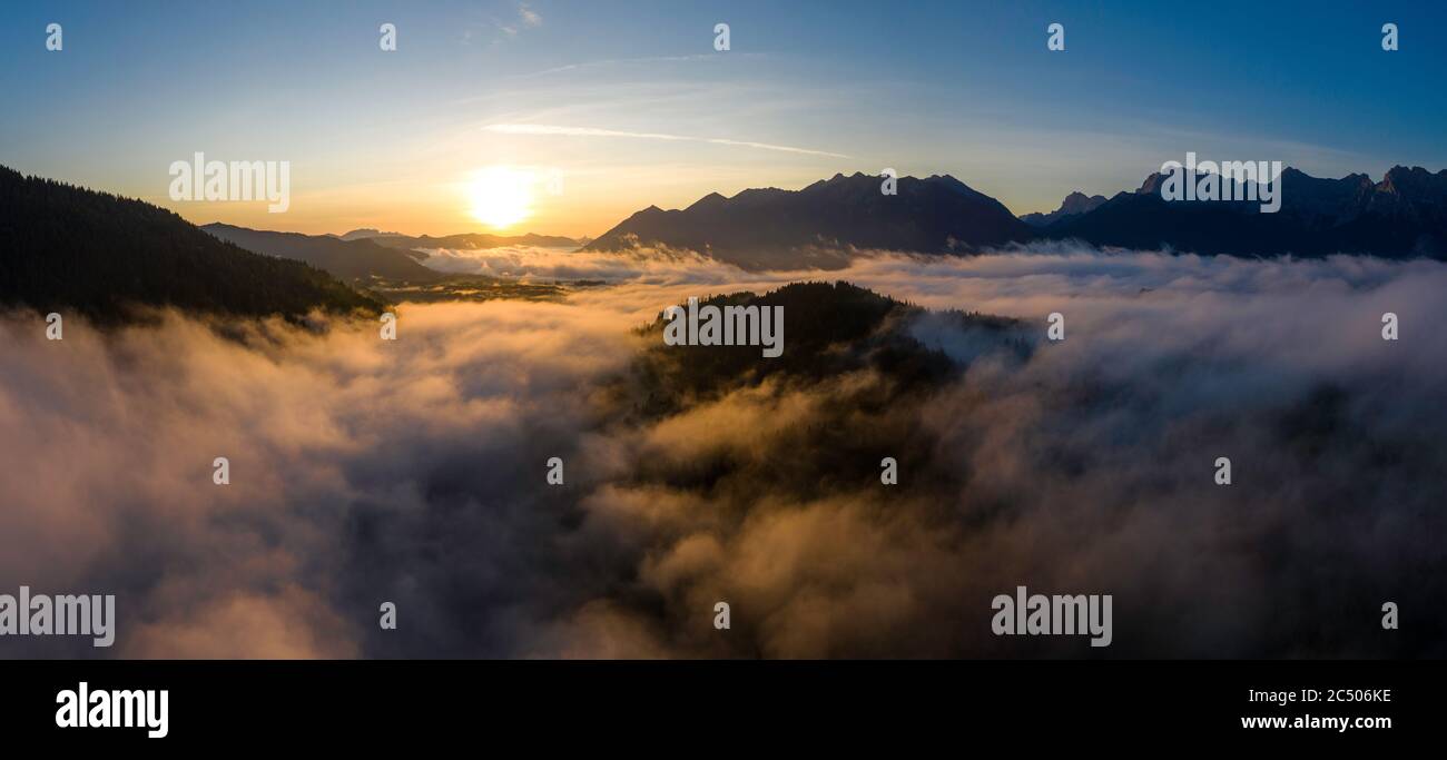 Aerial sunrise above cloud inversion in the mountains Stock Photo - Alamy