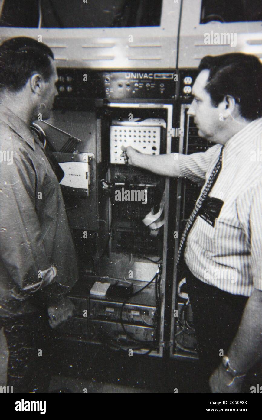 Fine 70s vintage black and white photography of two men discussing ...