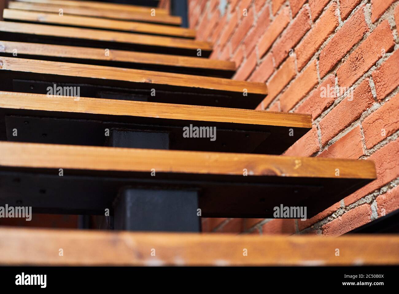 Stairs in loft apartment. Staircase without railing. Modern hipster ...