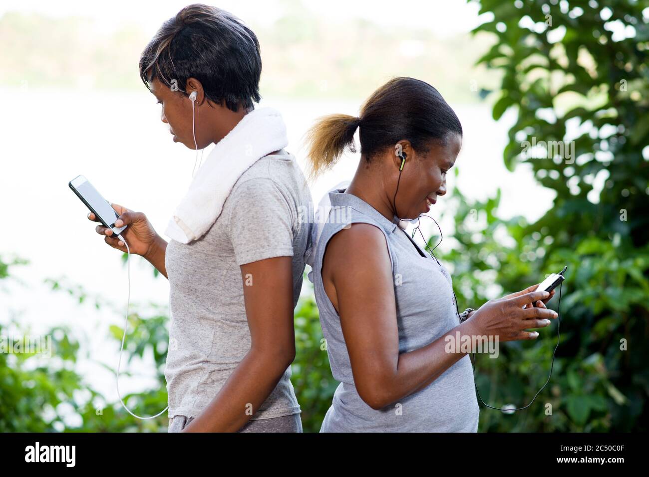Two Women Standing Backs High Resolution Stock Photography and Images ...