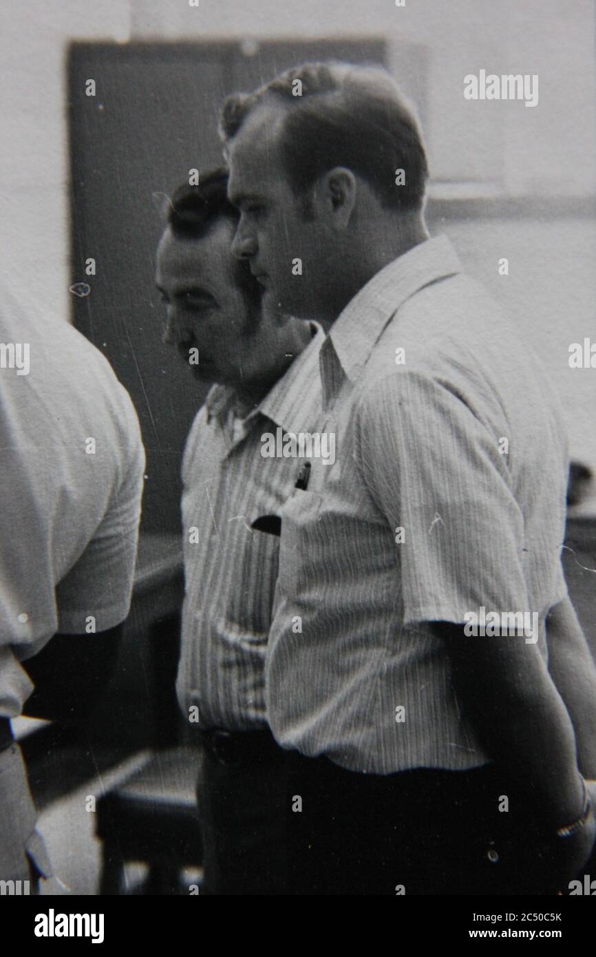 Fine 70s vintage black and white photography of professionals holding a ...