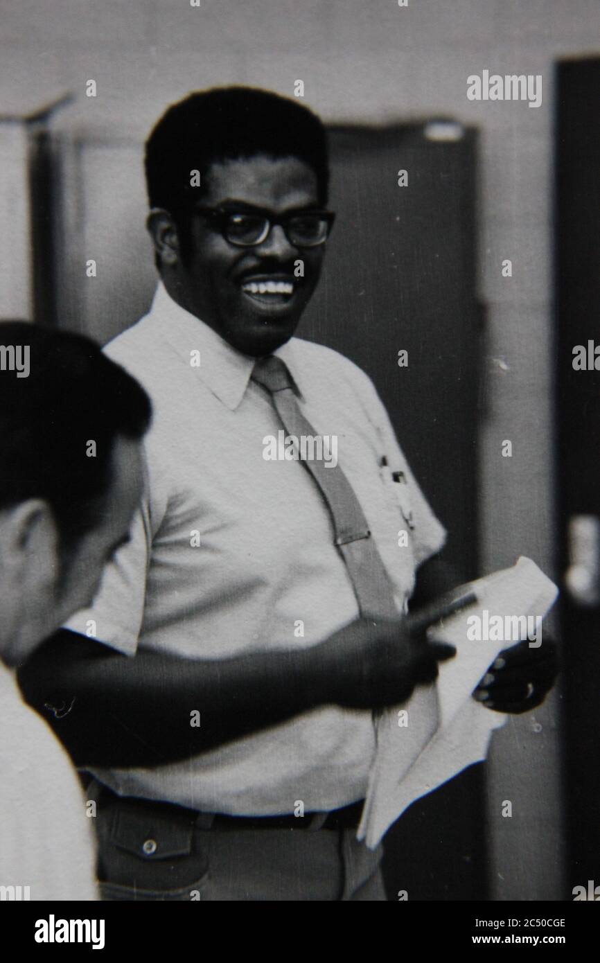 Fine 70s vintage black and white photography of professionals holding a ...