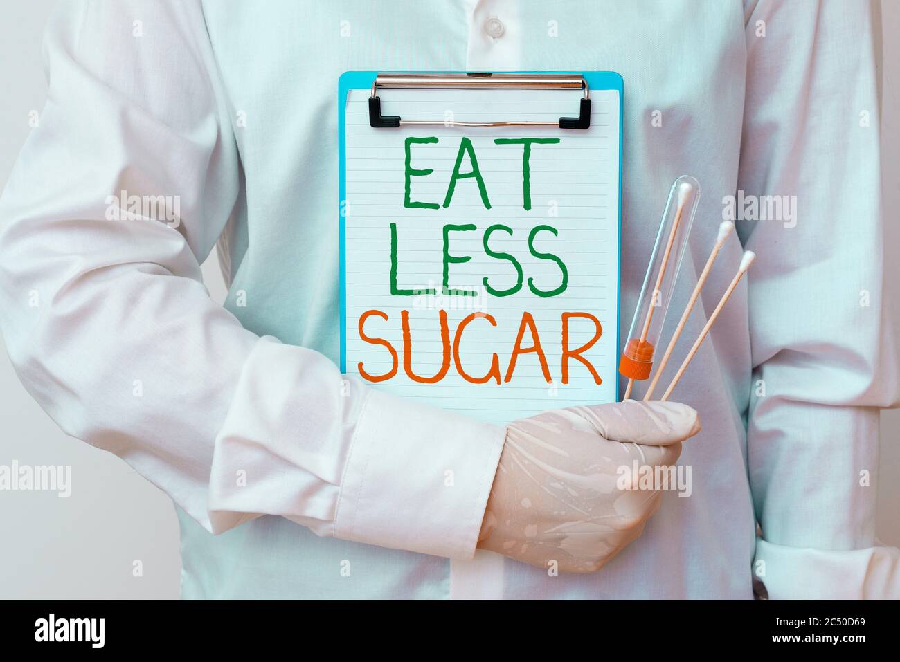 Writing note showing Eat Less Sugar. Business concept for reducing ...