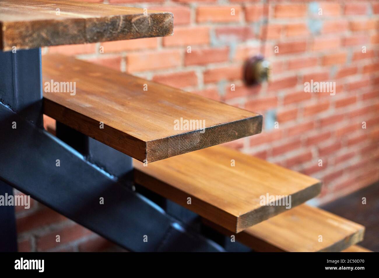 Stairs in loft apartment. Staircase without railing. Modern hipster ...