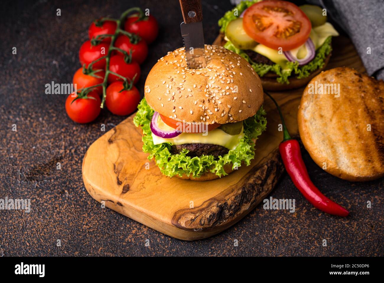 Burger and cheeseburger with tomato Stock Photo - Alamy