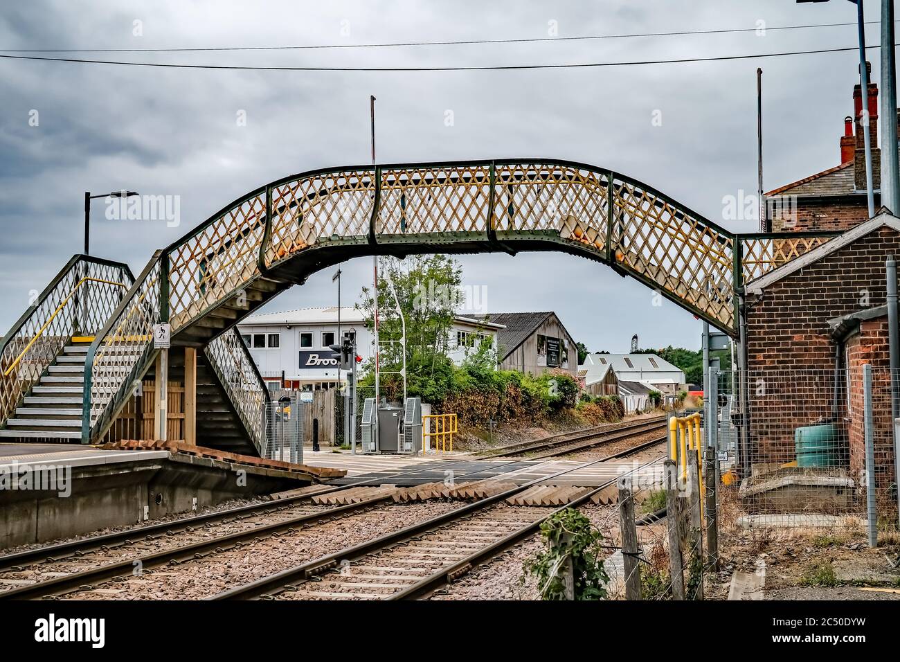 Old metal pedestrian bridge over the railway line in the Norfolk ...