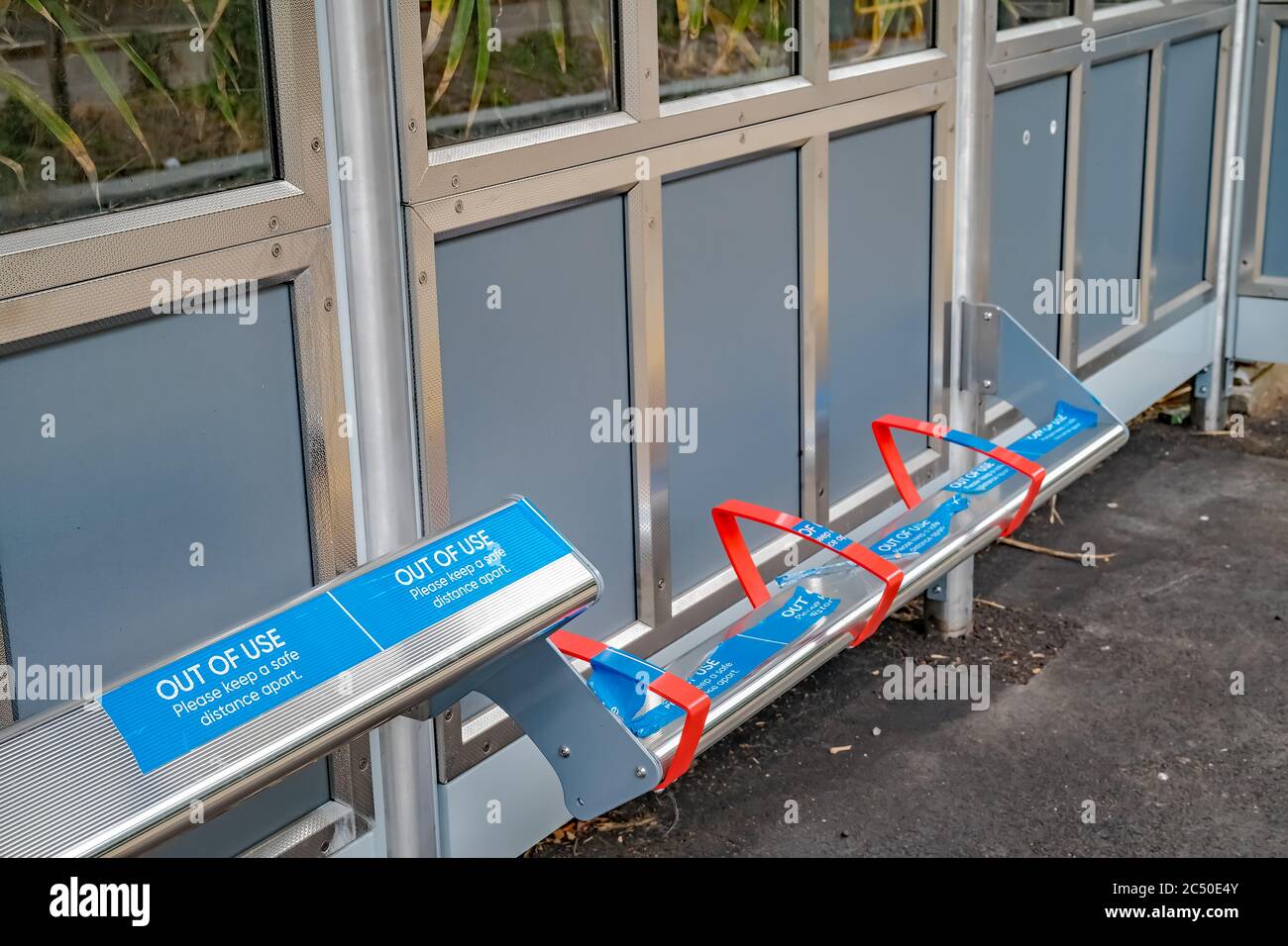 Seating in the shelter on the rail platform at Brundall Gardens out of ...