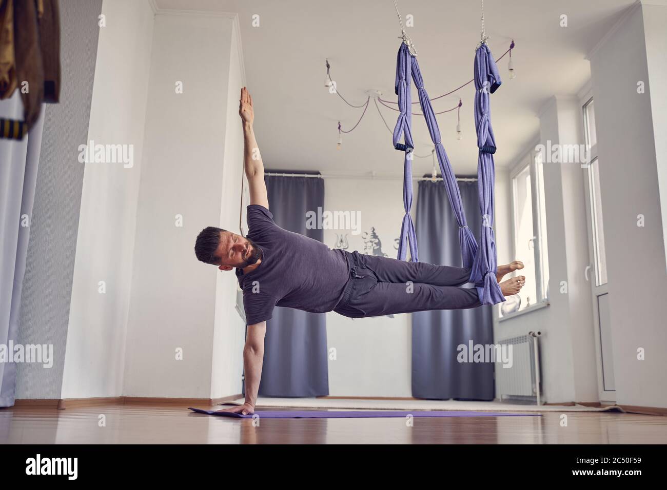 Aerial yoga exercise hi-res stock photography and images - Alamy